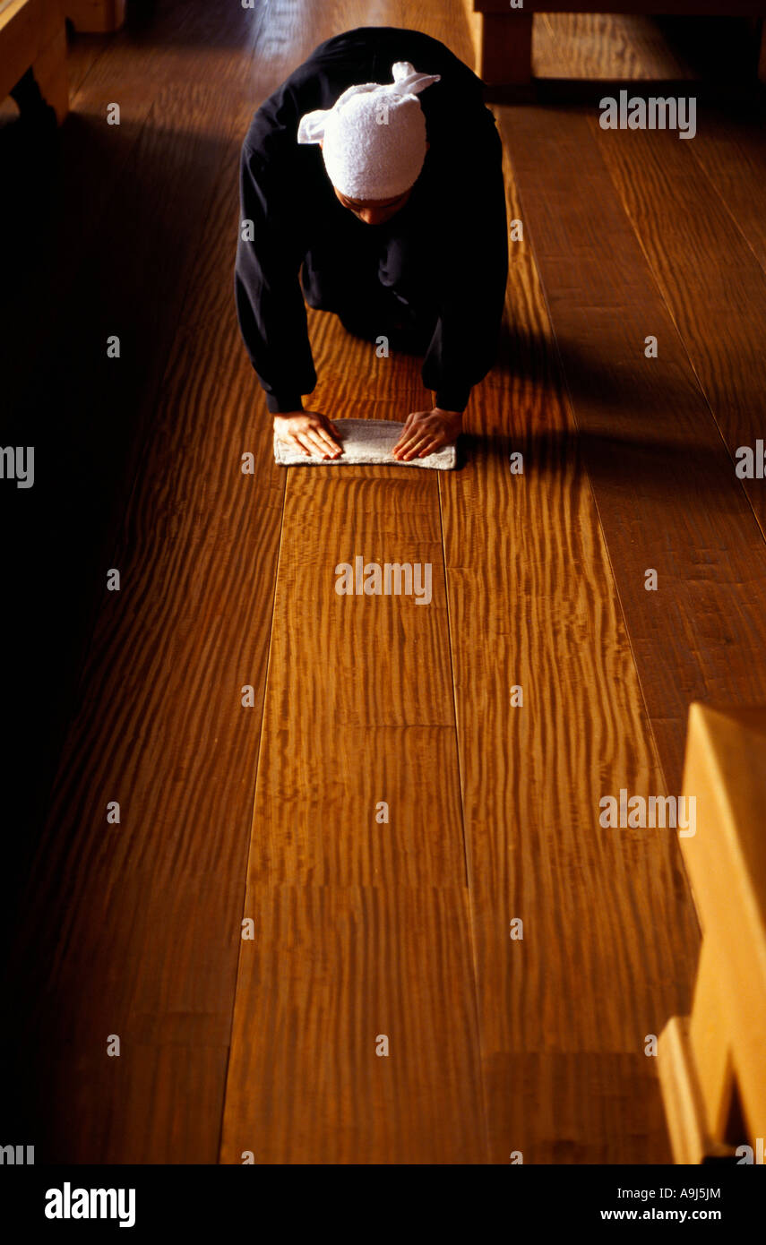 A Zen monk of the Soto School cleans the meditation hall in the ...