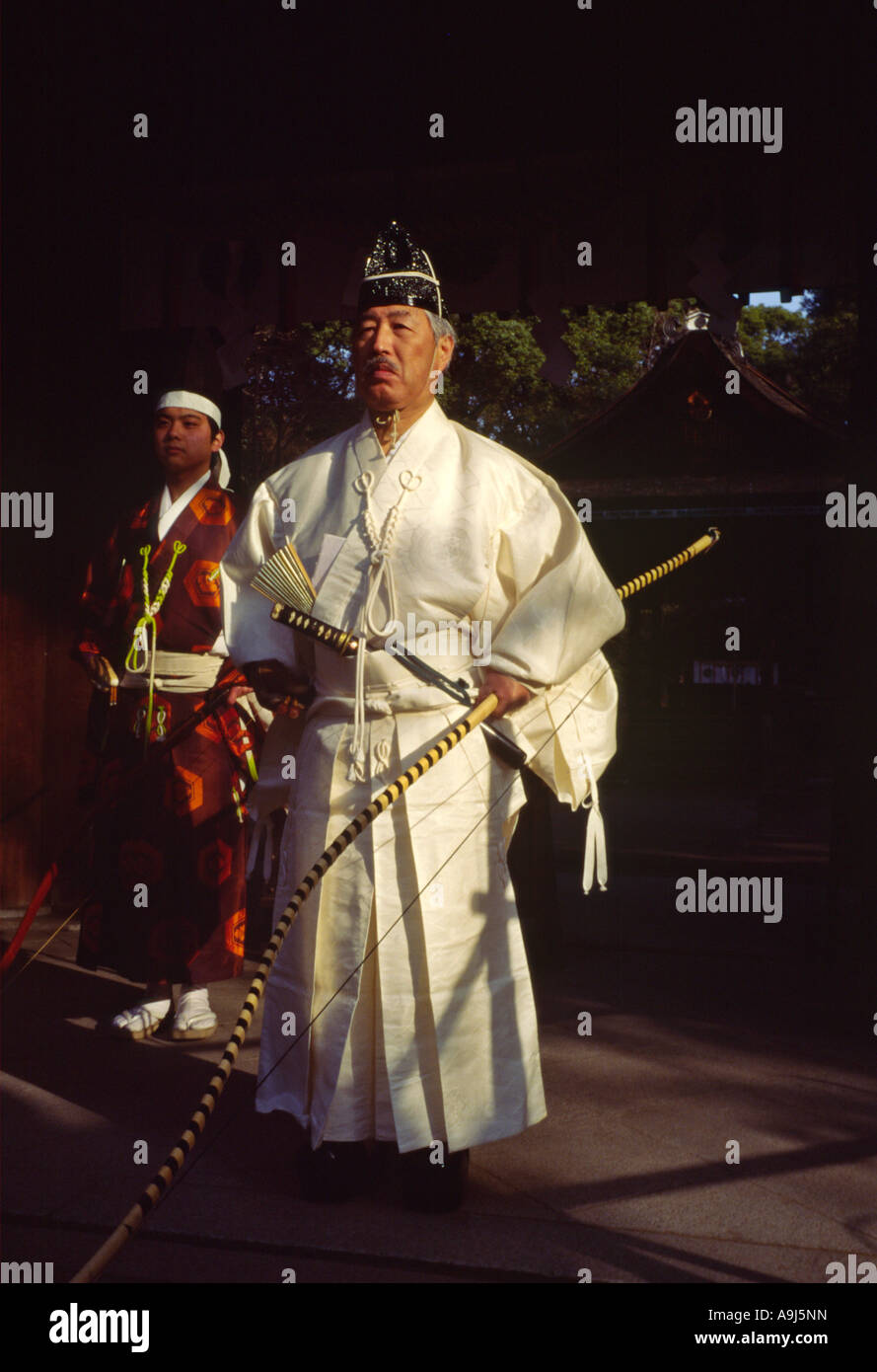 Murata Takeshi and Fujita Takehiro in traditional Kyudo costume stand ...