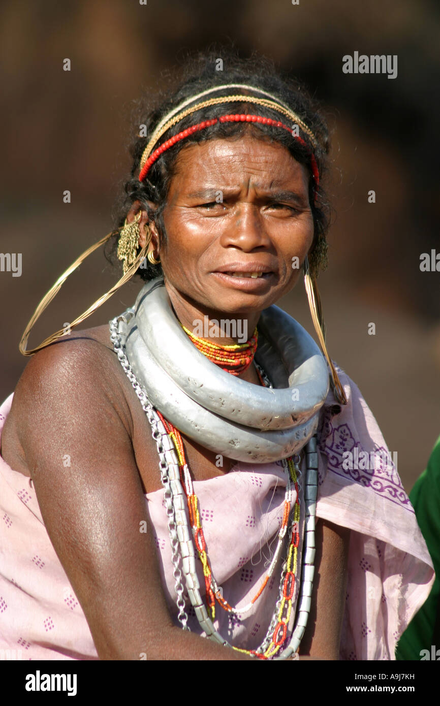 A Gadaba tribal woman wearing traditional heavy metal necklaces .Orissa ...