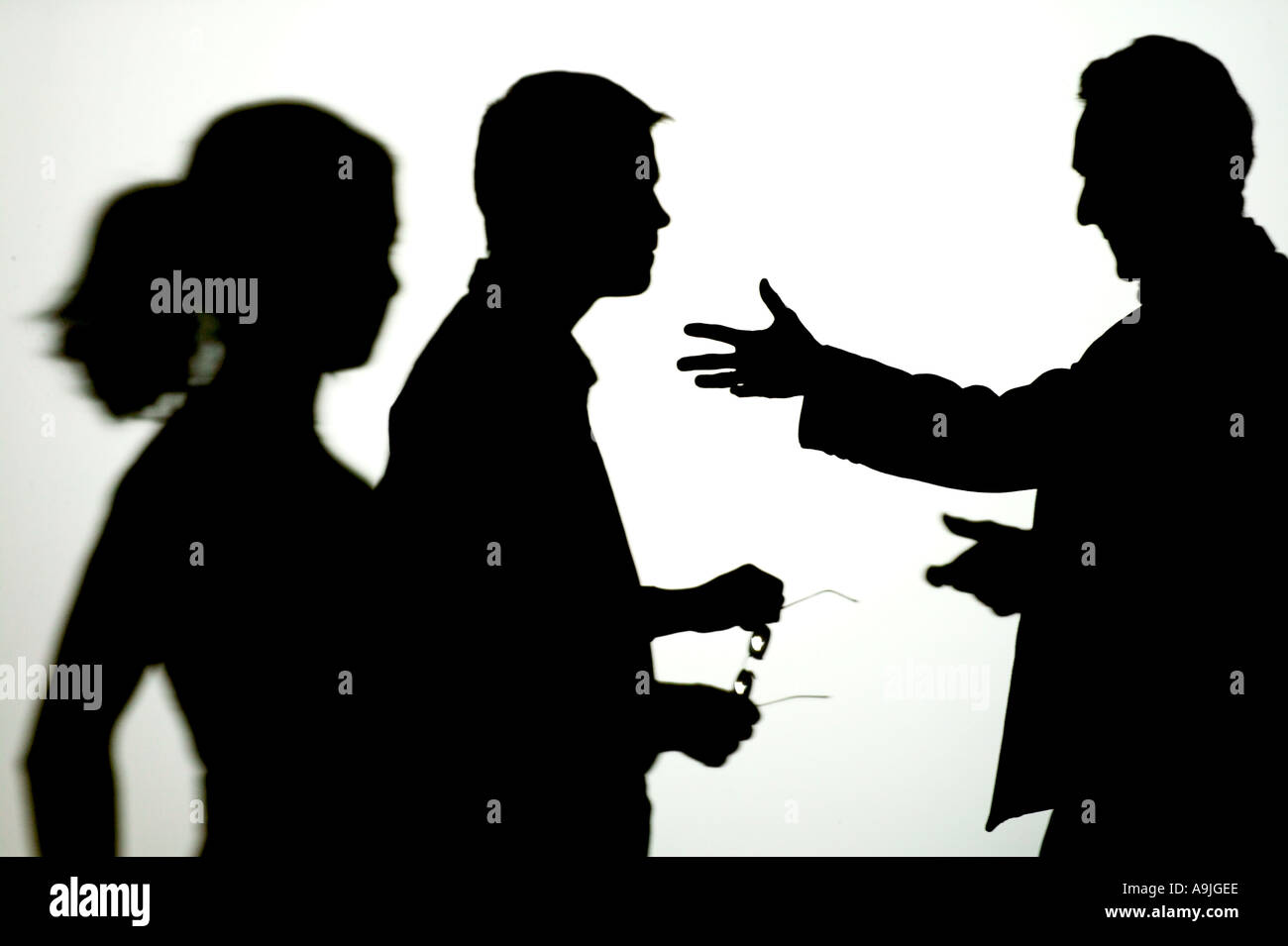 a group of people discussing Stock Photo - Alamy