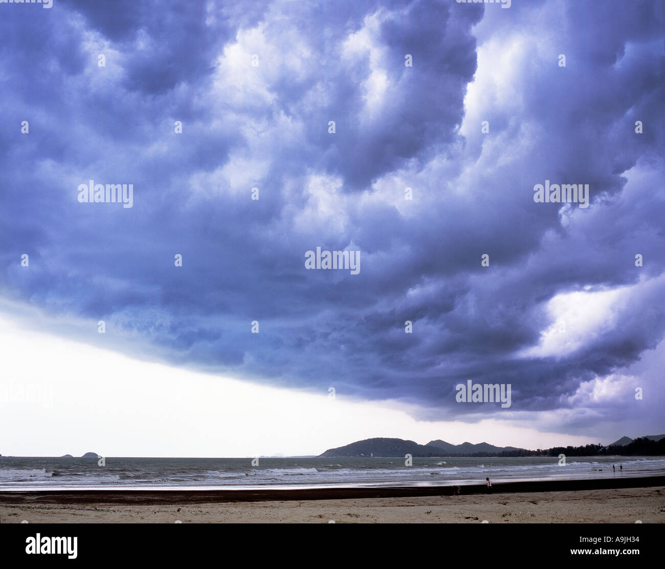 bad weather clouds on a beach Stock Photo - Alamy