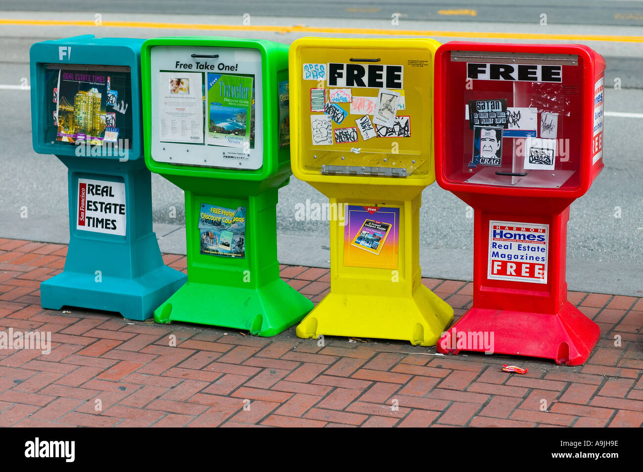 four boxes in different colors with magazines in them Stock Photo - Alamy