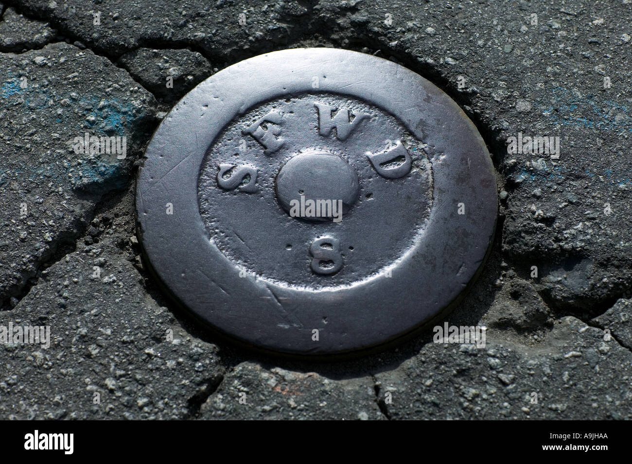 round metal sign with letters on Stock Photo - Alamy