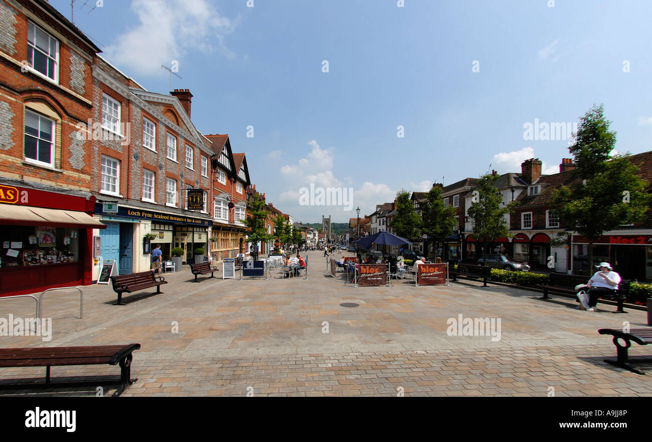Cafes and the main street of Henley on Thames with the Holy Trinity ...