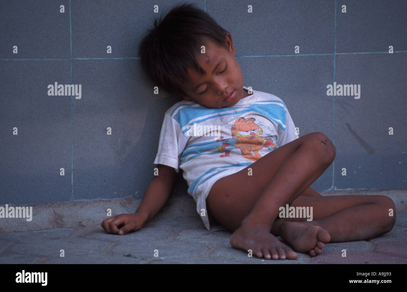 Homeless children street sleeping hi-res stock photography and images ...
