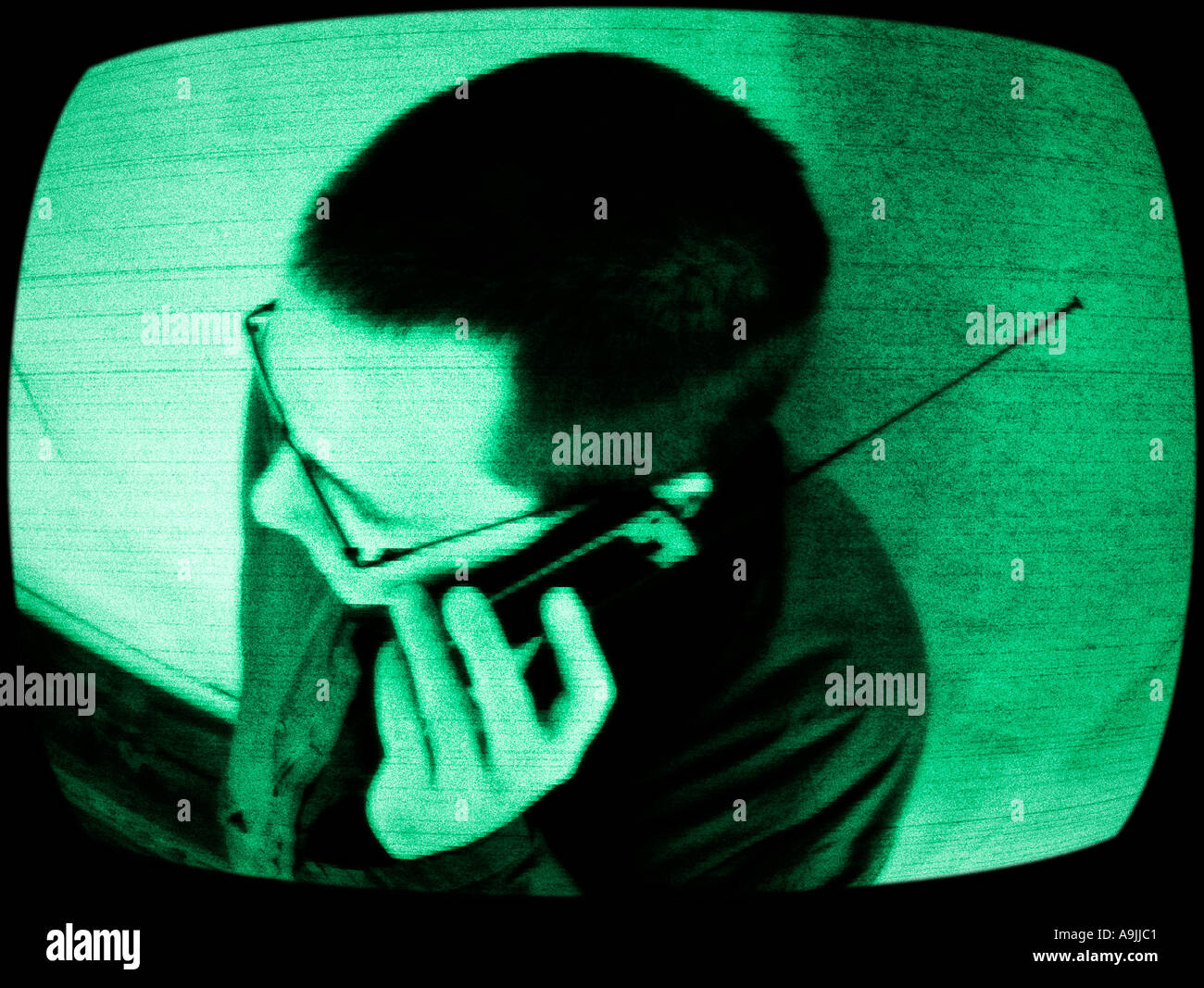 surveilance camera showing man with cellphone Stock Photo - Alamy