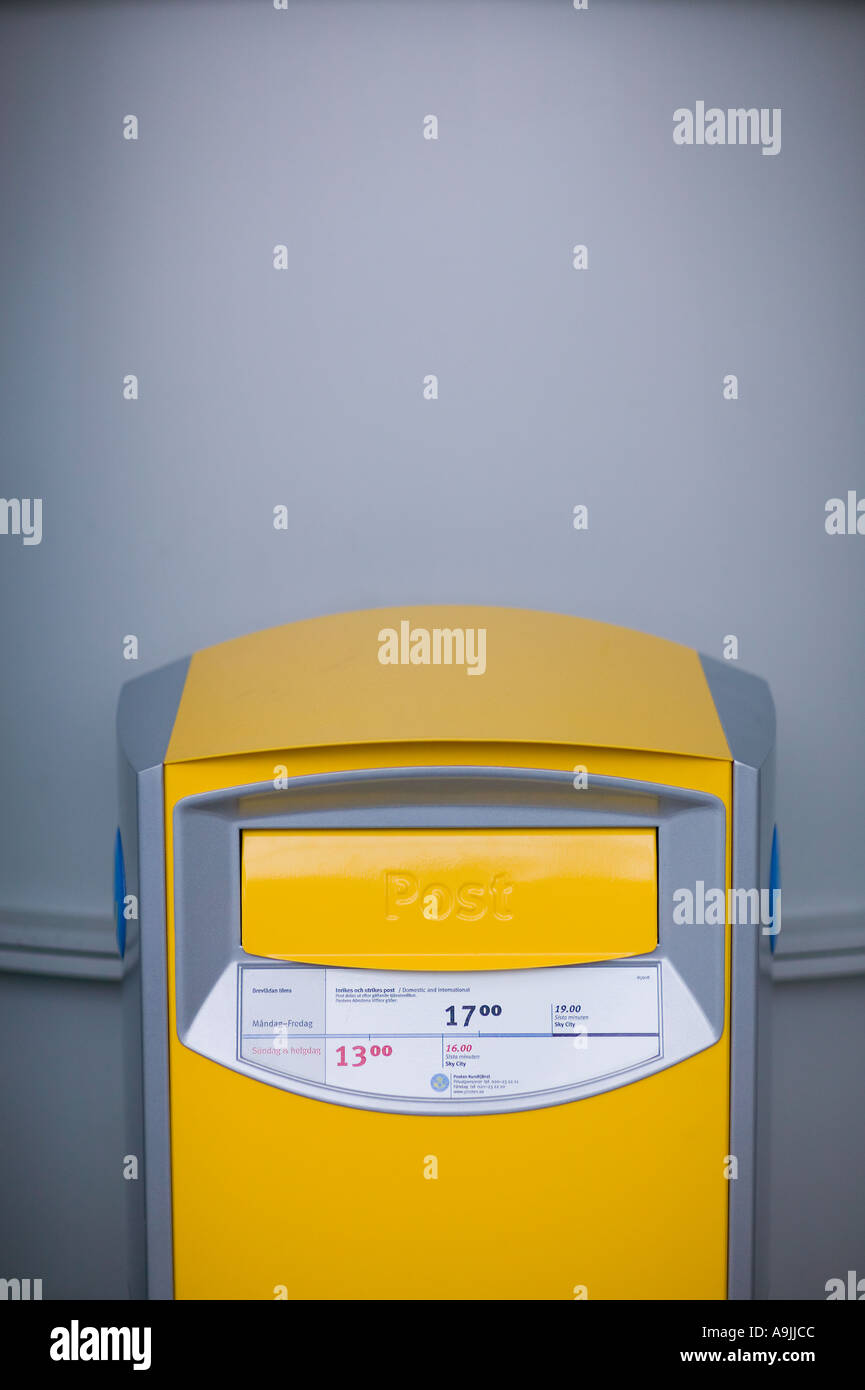 yellow mailbox with grey wall behind Stock Photo - Alamy