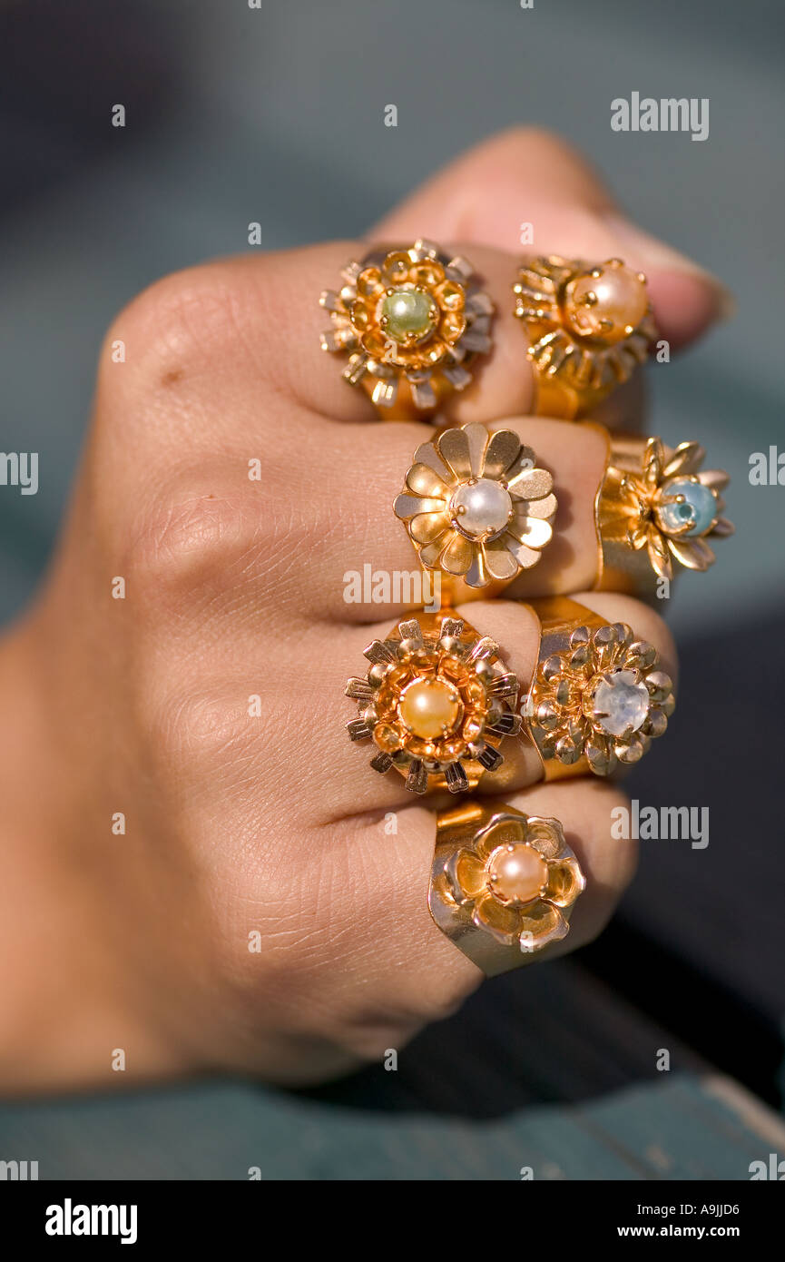 hand with golden rings Stock Photo - Alamy