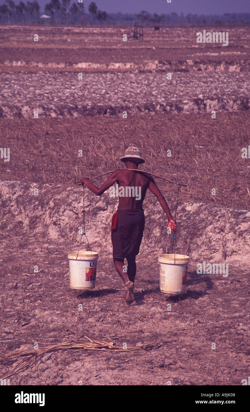 Man carrying buckets dry hi-res stock photography and images - Alamy