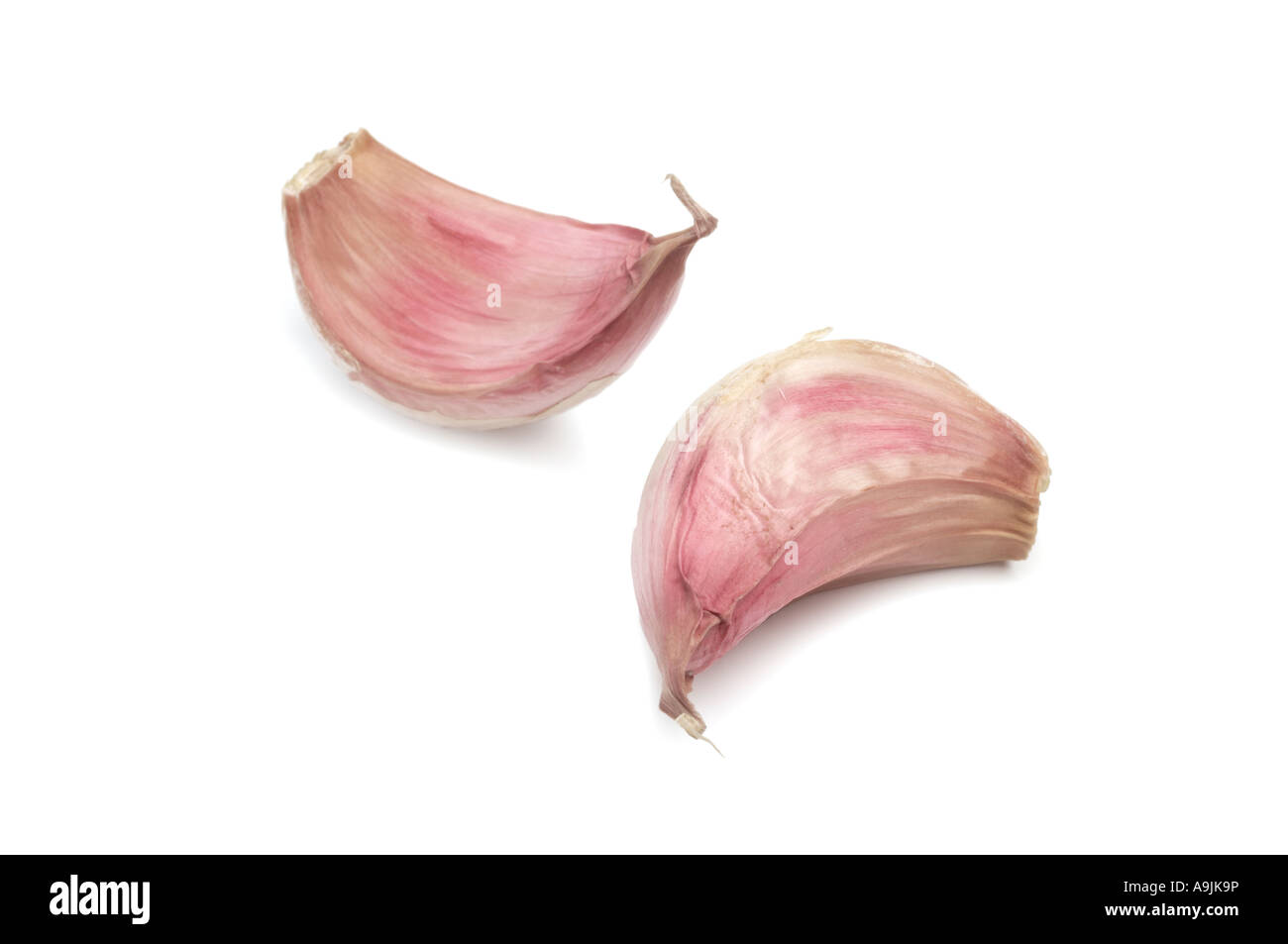 Two garlic cloves Stock Photo - Alamy