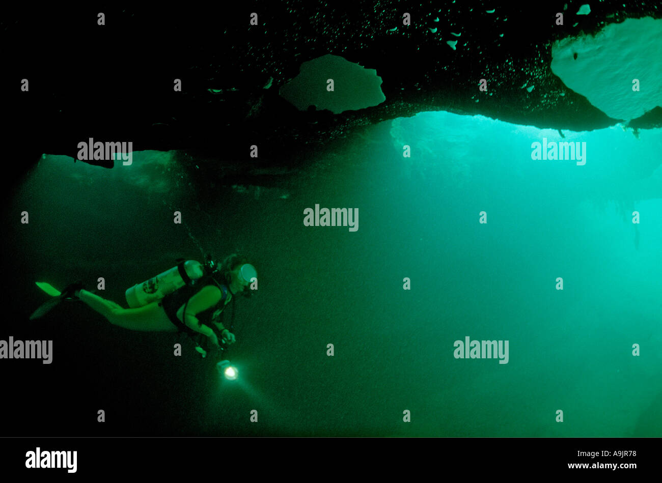 Cave diving Scuba diver in underwater cave Stock Photo - Alamy