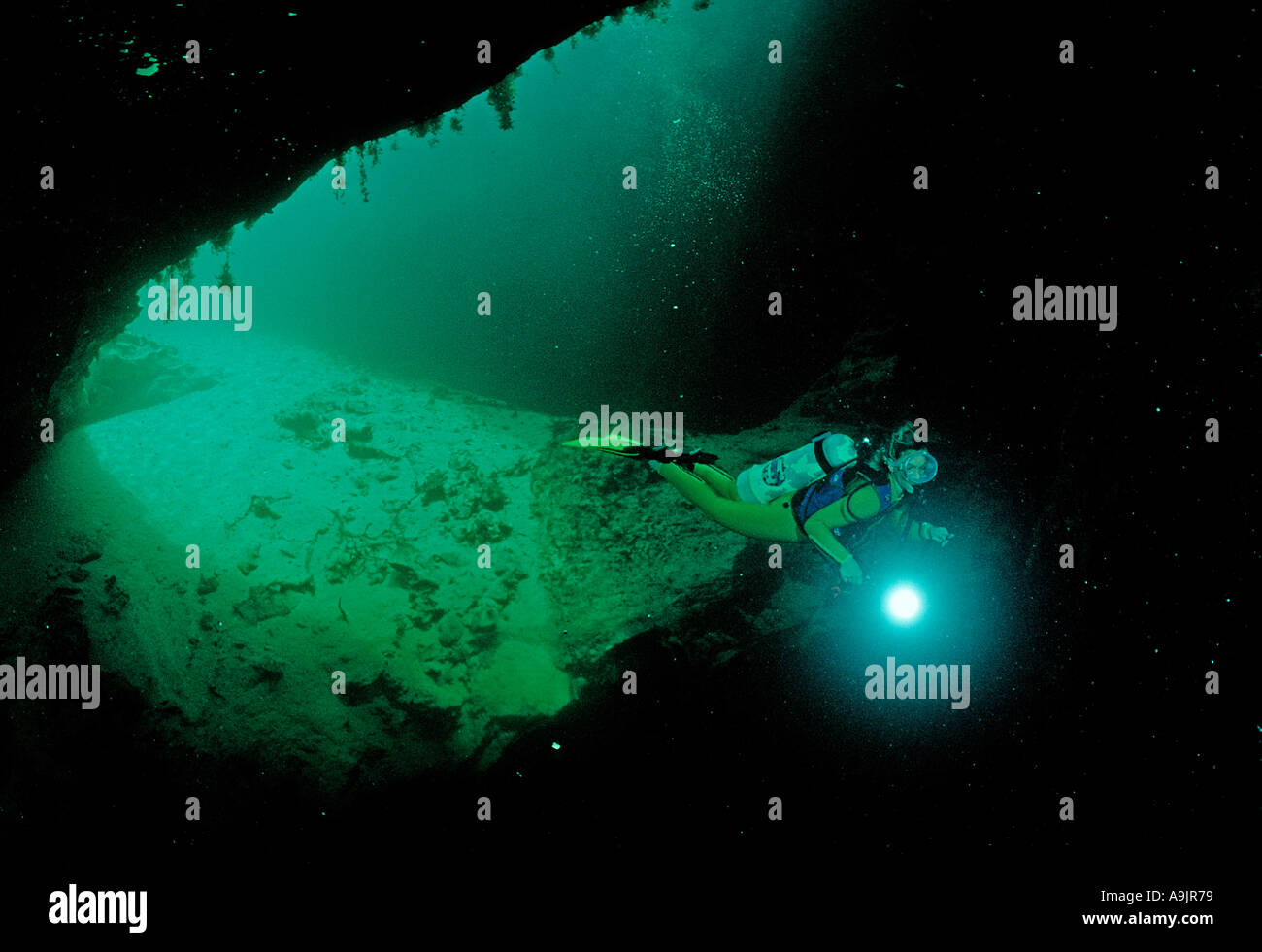 Cave diving Scuba diver in underwater cave Stock Photo - Alamy
