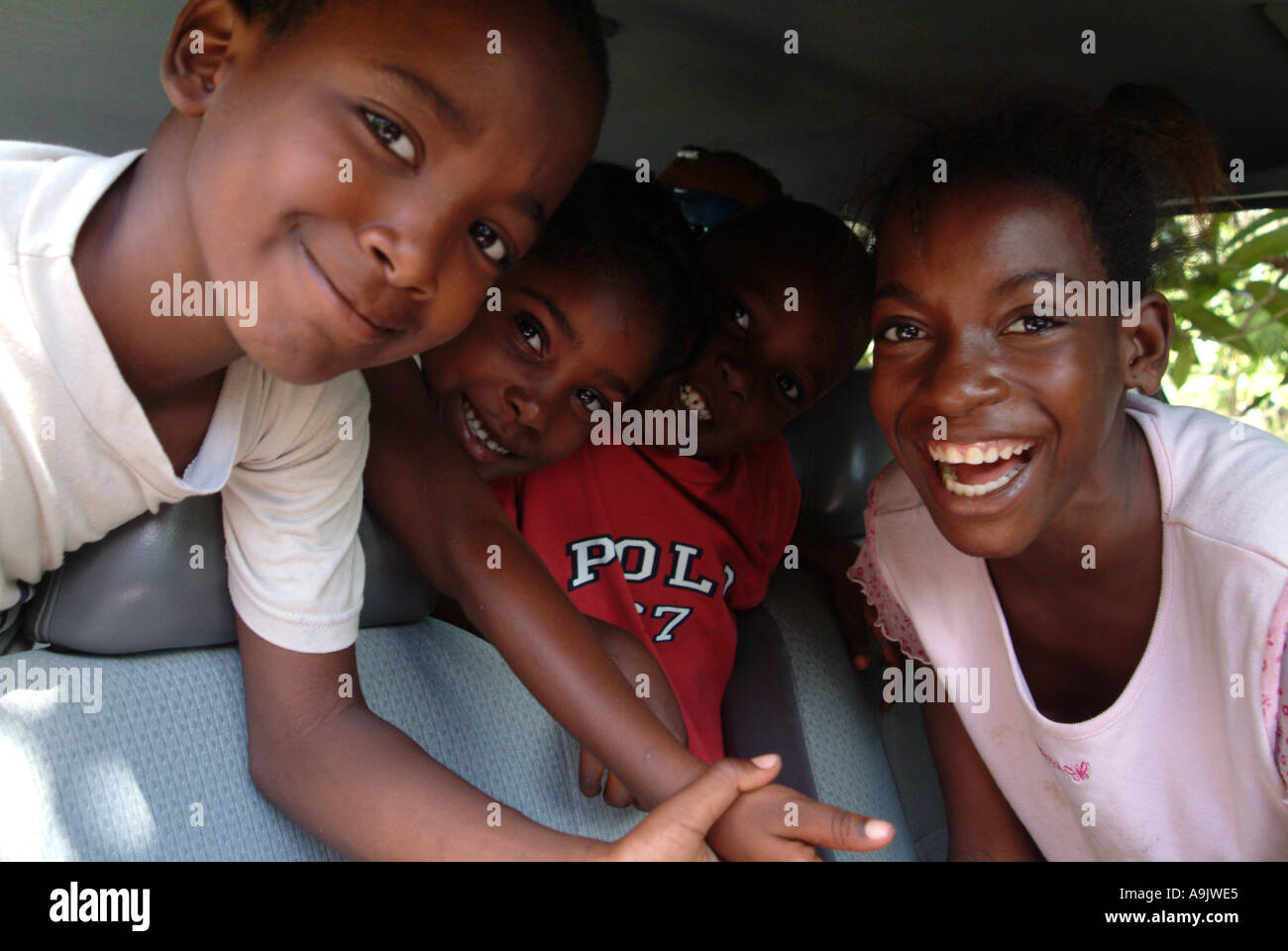 Portrait of children inside a car Stock Photo - Alamy