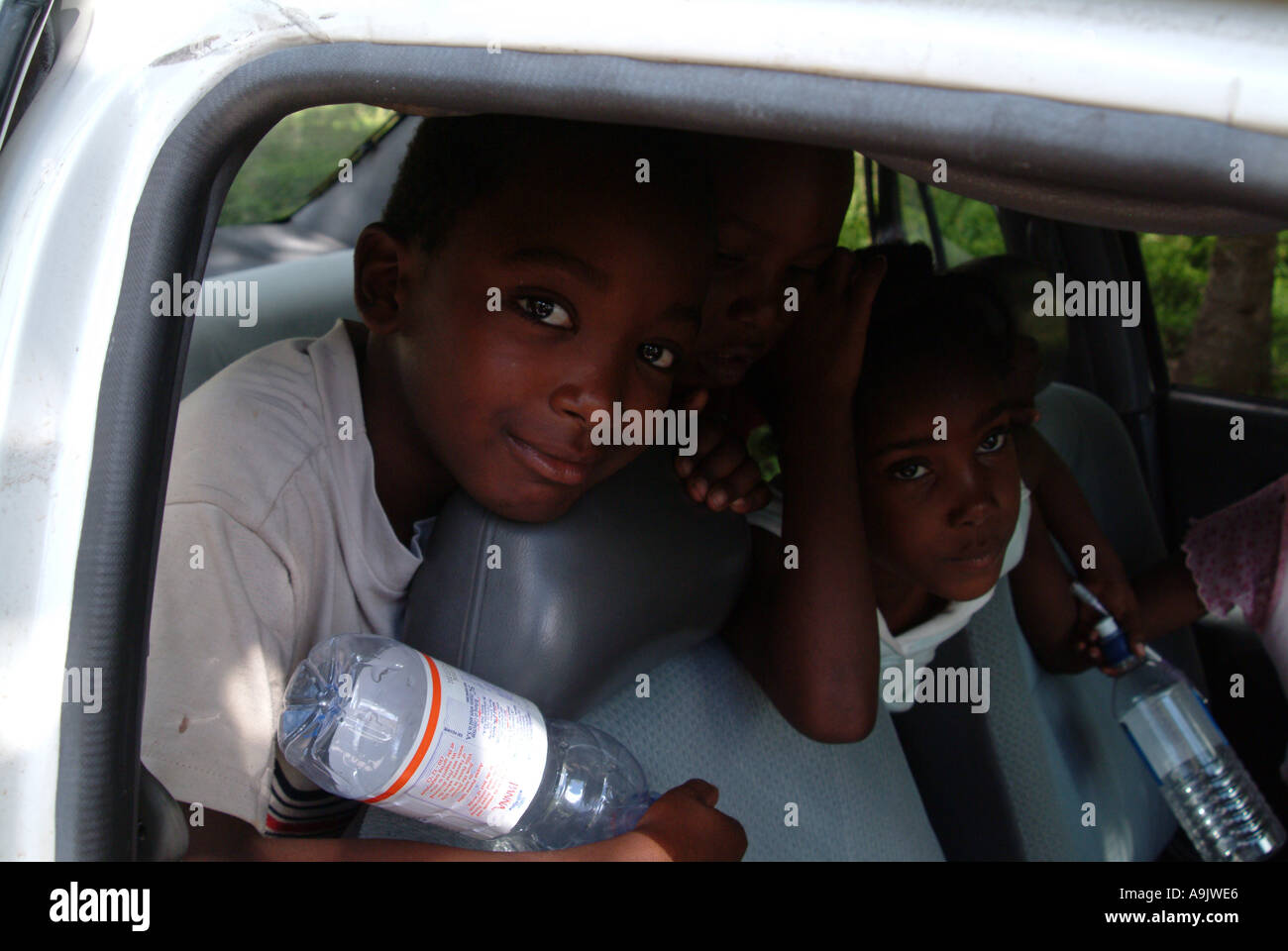 Group of children inside a car Stock Photo - Alamy