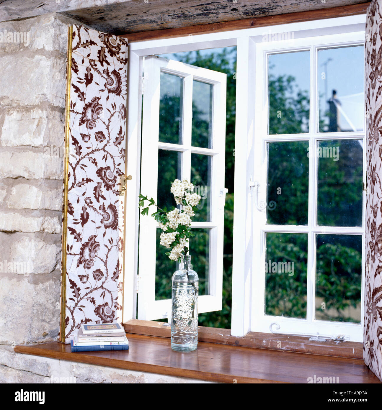 Close-up of open window and patterned shutters Stock Photo - Alamy