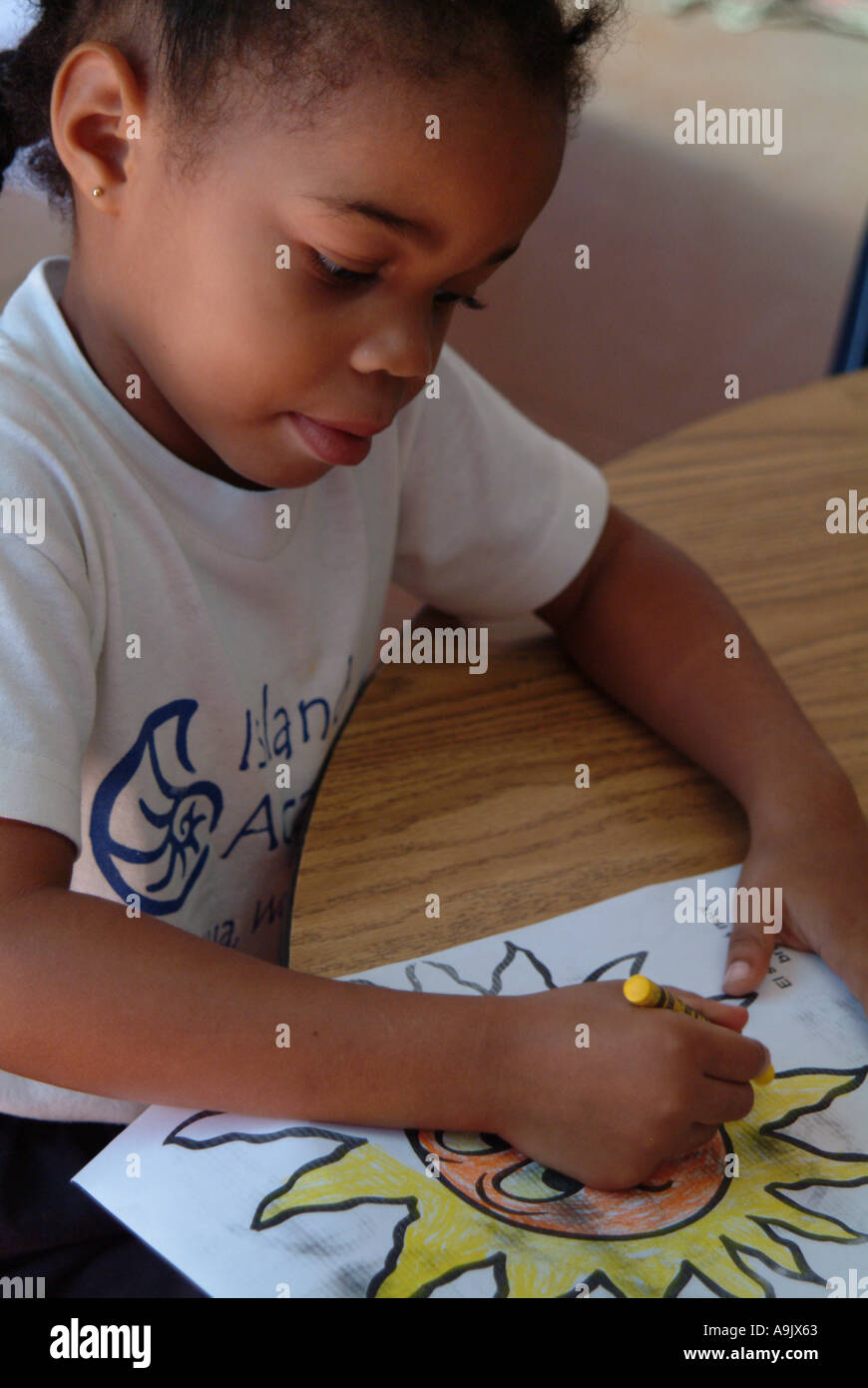 Young girl colouring in with crayons Stock Photo - Alamy