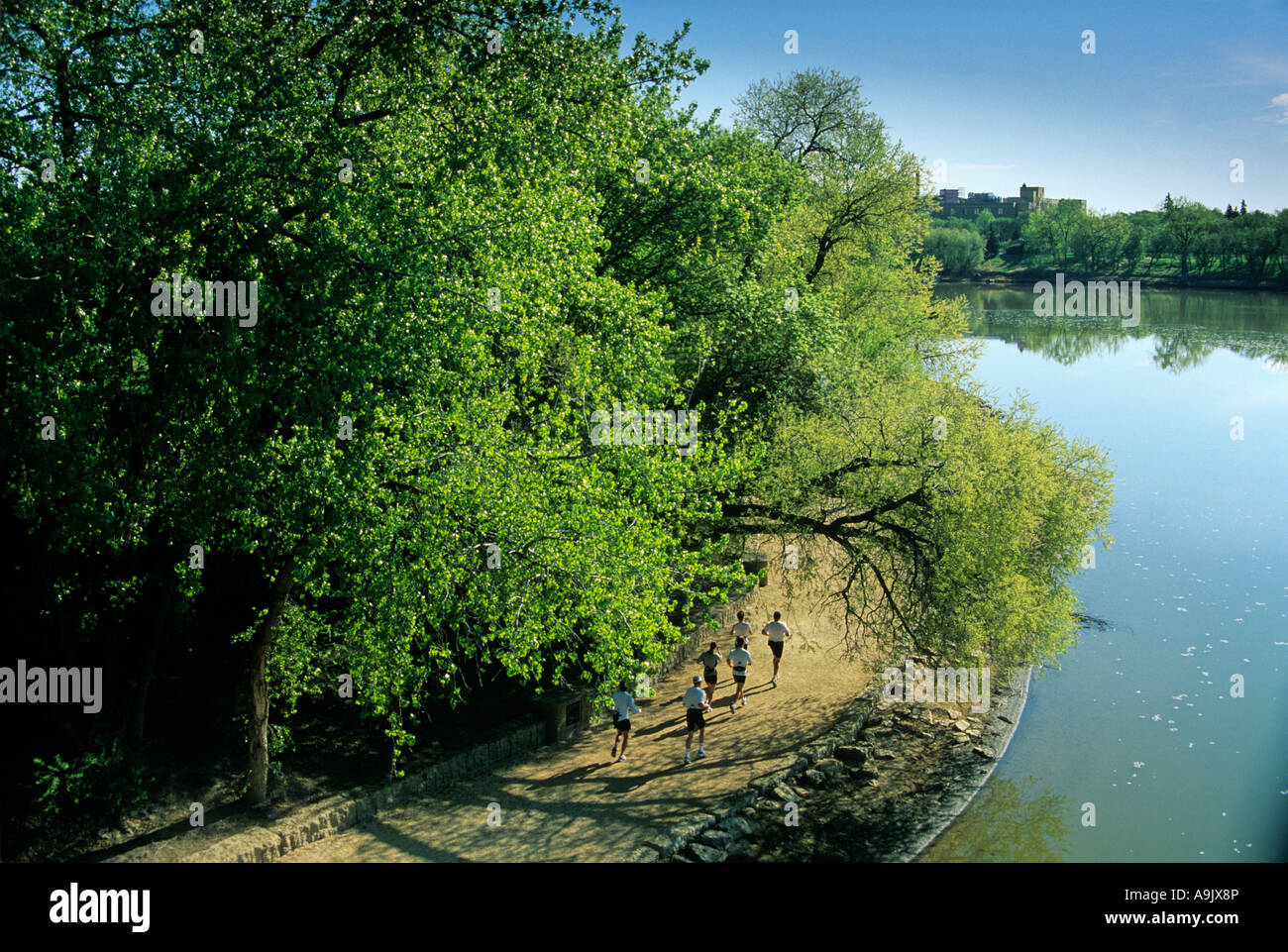 Runners along river walkway following Red River Forks National Historic ...