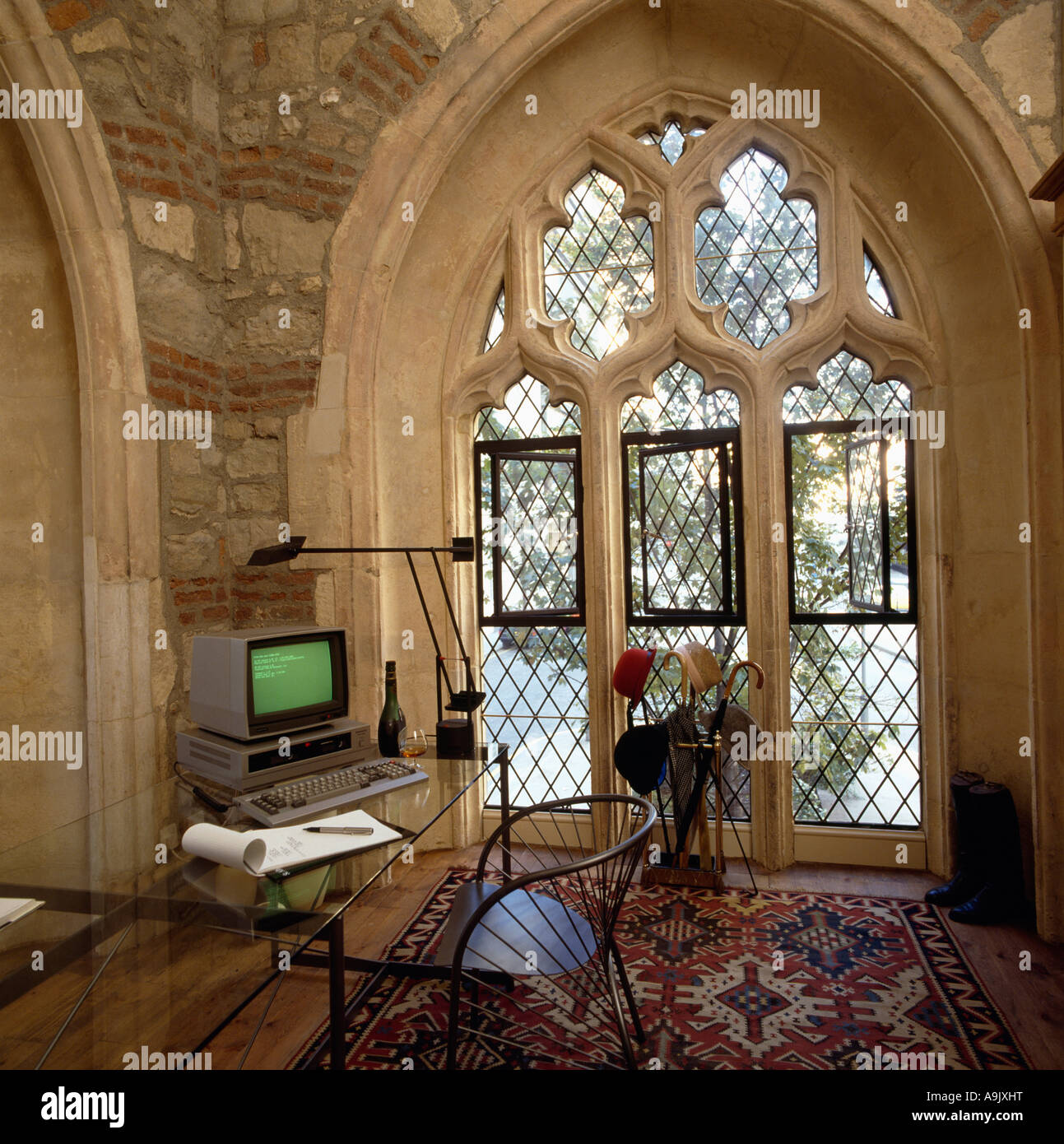 Homeoffice in converted church with computer on table in front of ...