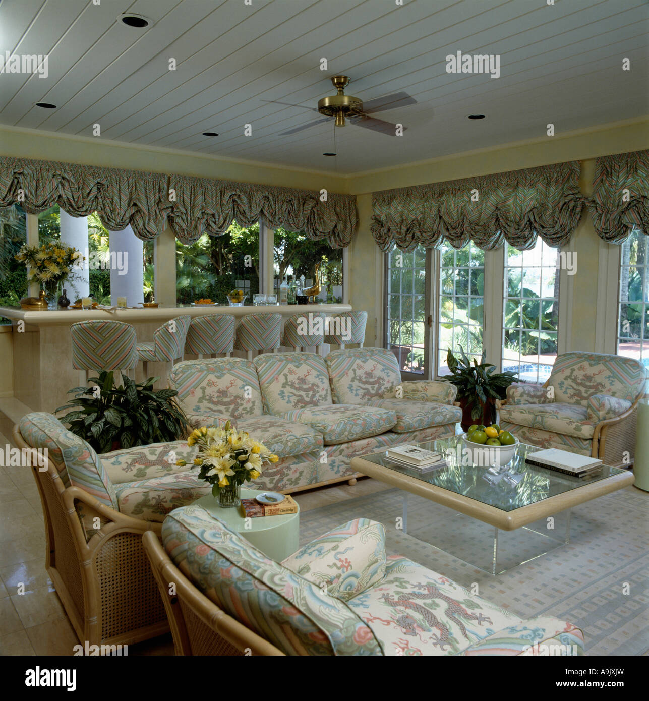 Festoon blinds at windows in eighties livingroom with patterned ...