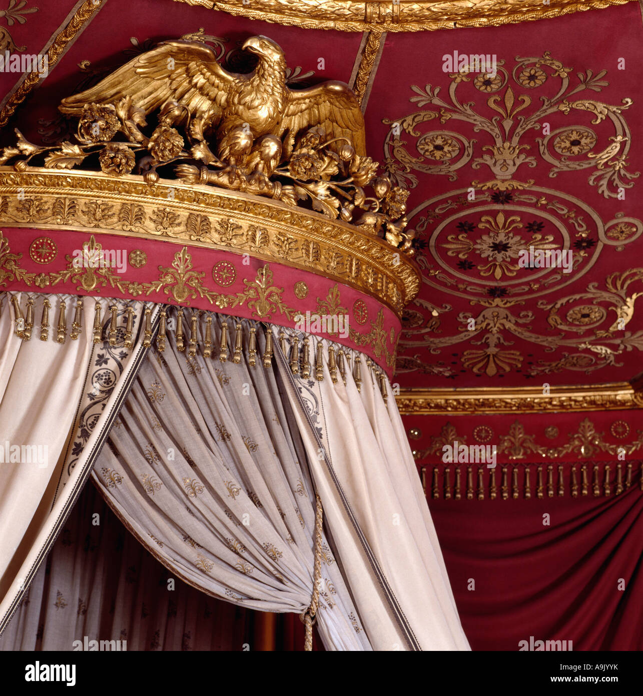 Close-up of gold baroque coronet on ornate bed Stock Photo - Alamy