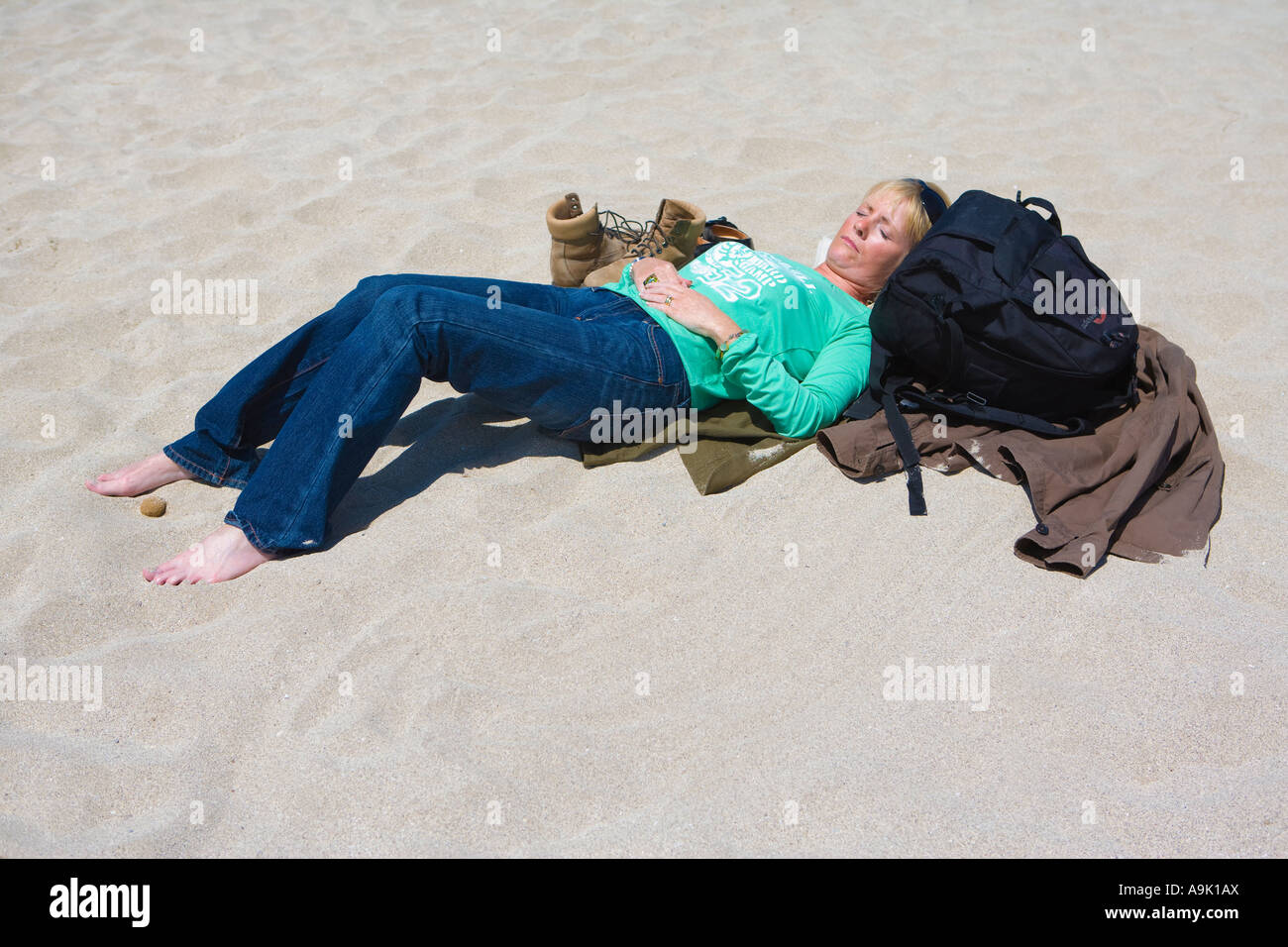 SLEEPING ROUGH ON A BEACH Stock Photo - Alamy