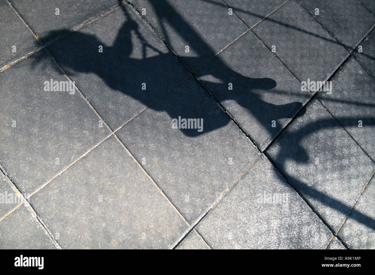 shadow of a child on a swing Stock Photo - Alamy