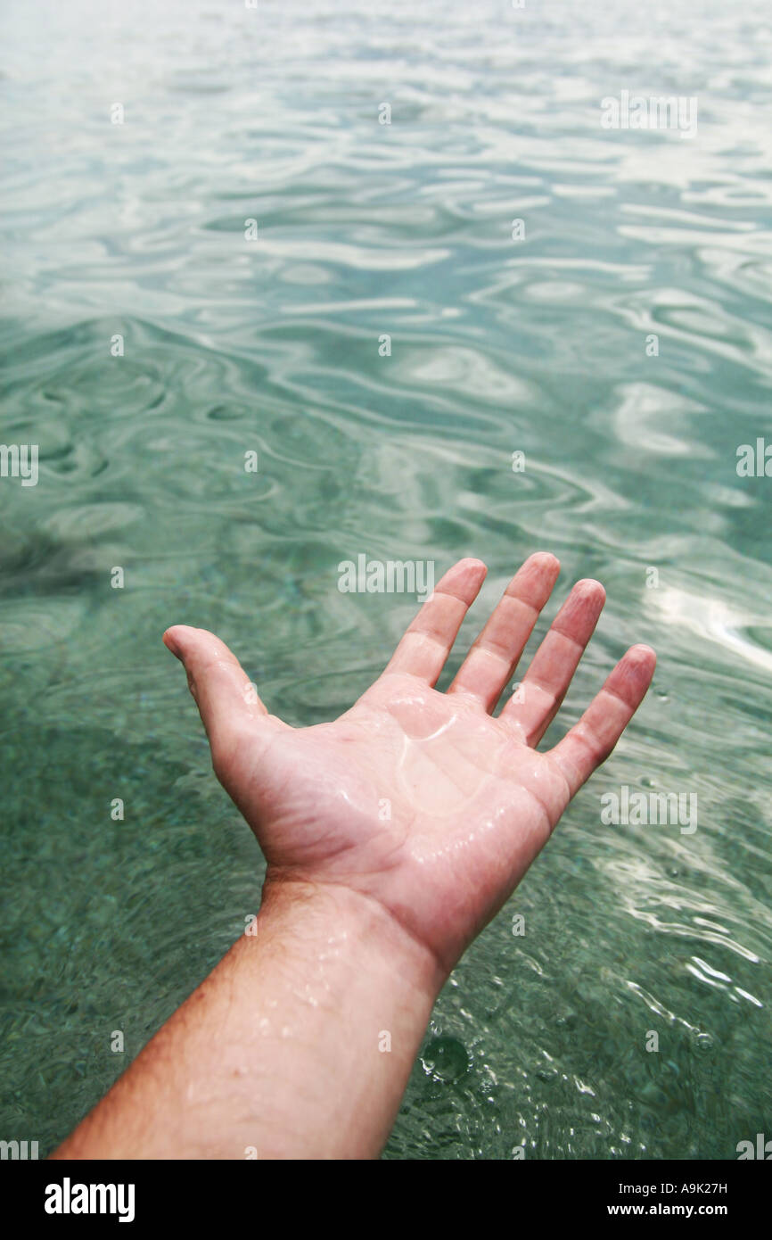 outstretched hand over water Stock Photo - Alamy