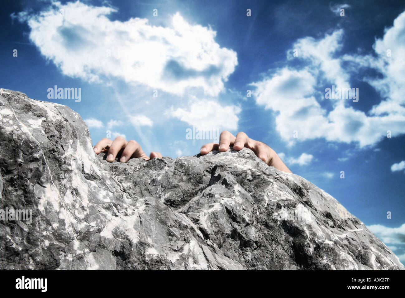 hands clinging on rock face Stock Photo - Alamy