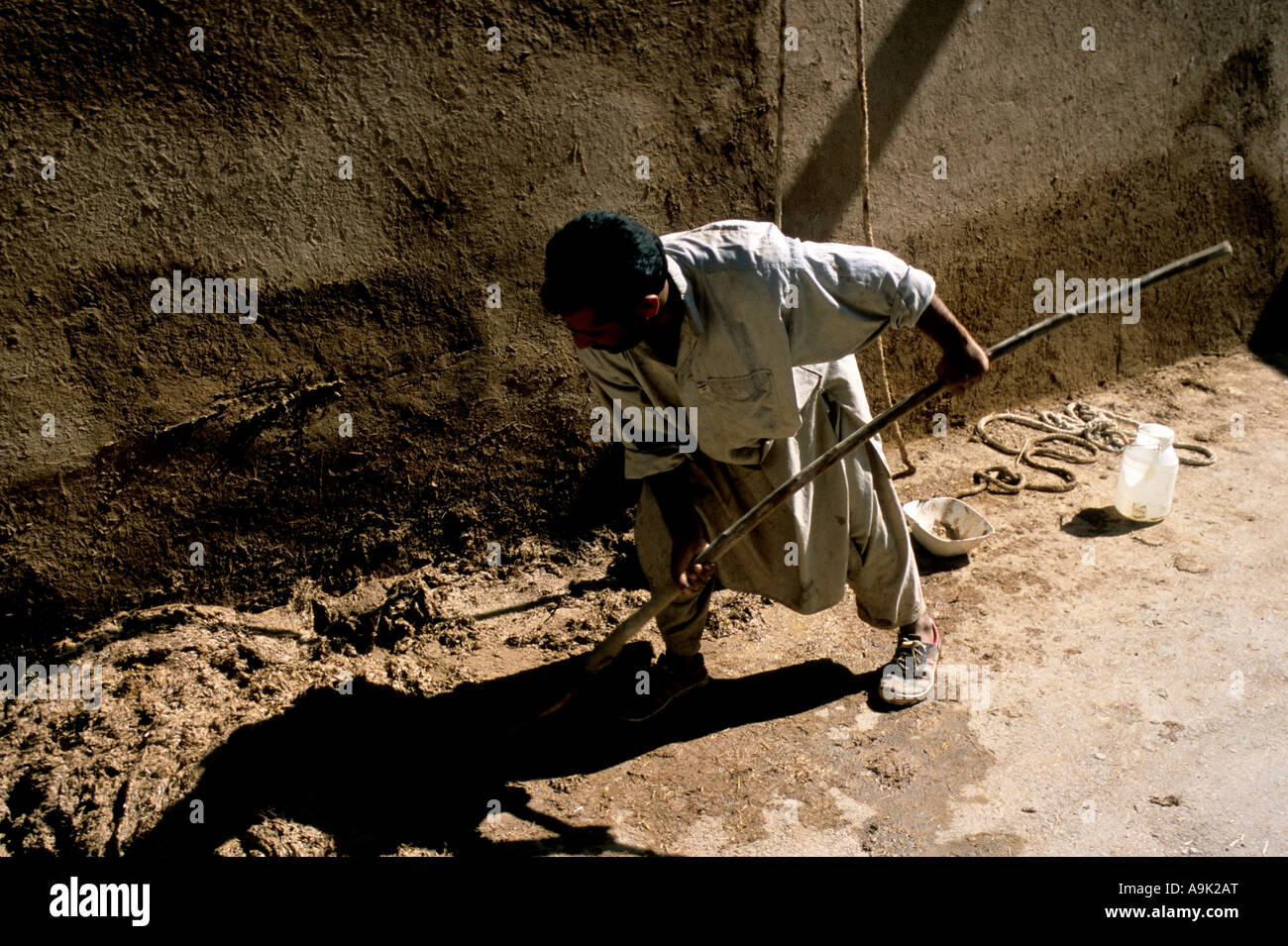 Mixing mud with water hi-res stock photography and images - Alamy