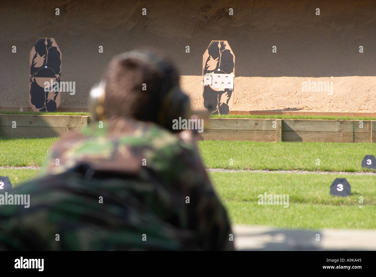 Cadet target shooting with a rifle on a 22 range target in focus Stock ...