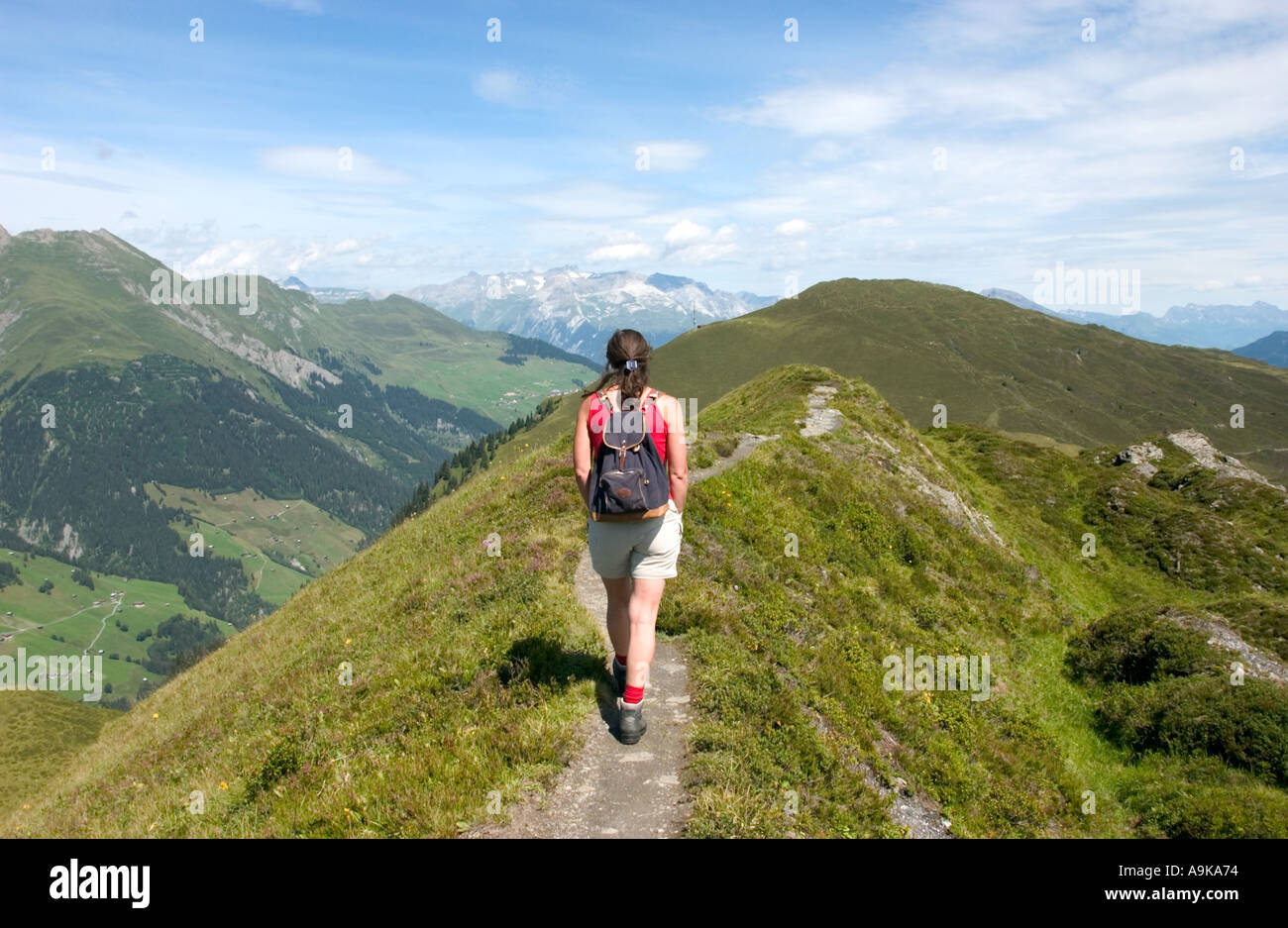 female wanderer in the mountains of swiss canton graubuenden Stock ...