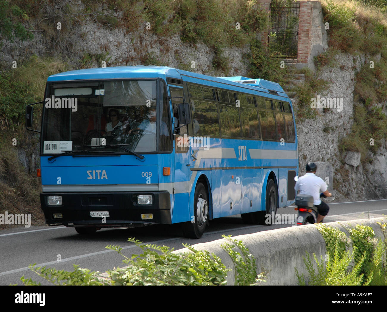 Italian blue bus on a mountain road Stock Photo - Alamy