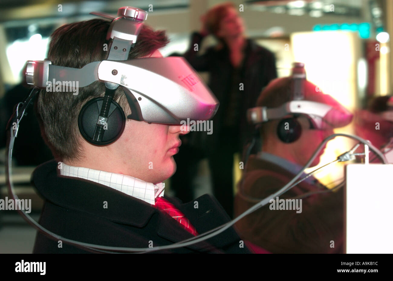 Visitor of the Computer Fair CeBIT 2004 with a cyber helmet Stock Photo - Alamy