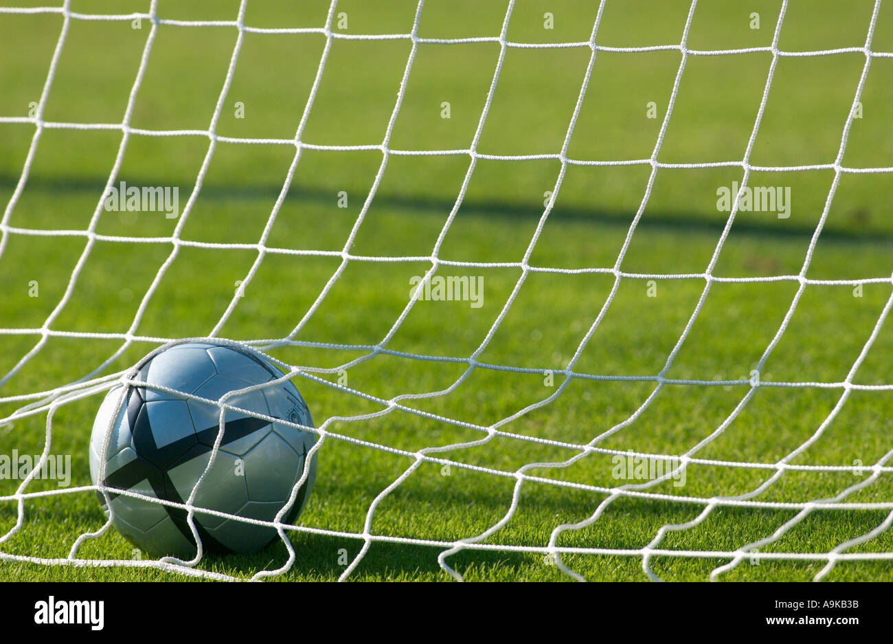 Soccer ball goal net Stock Photo - Alamy