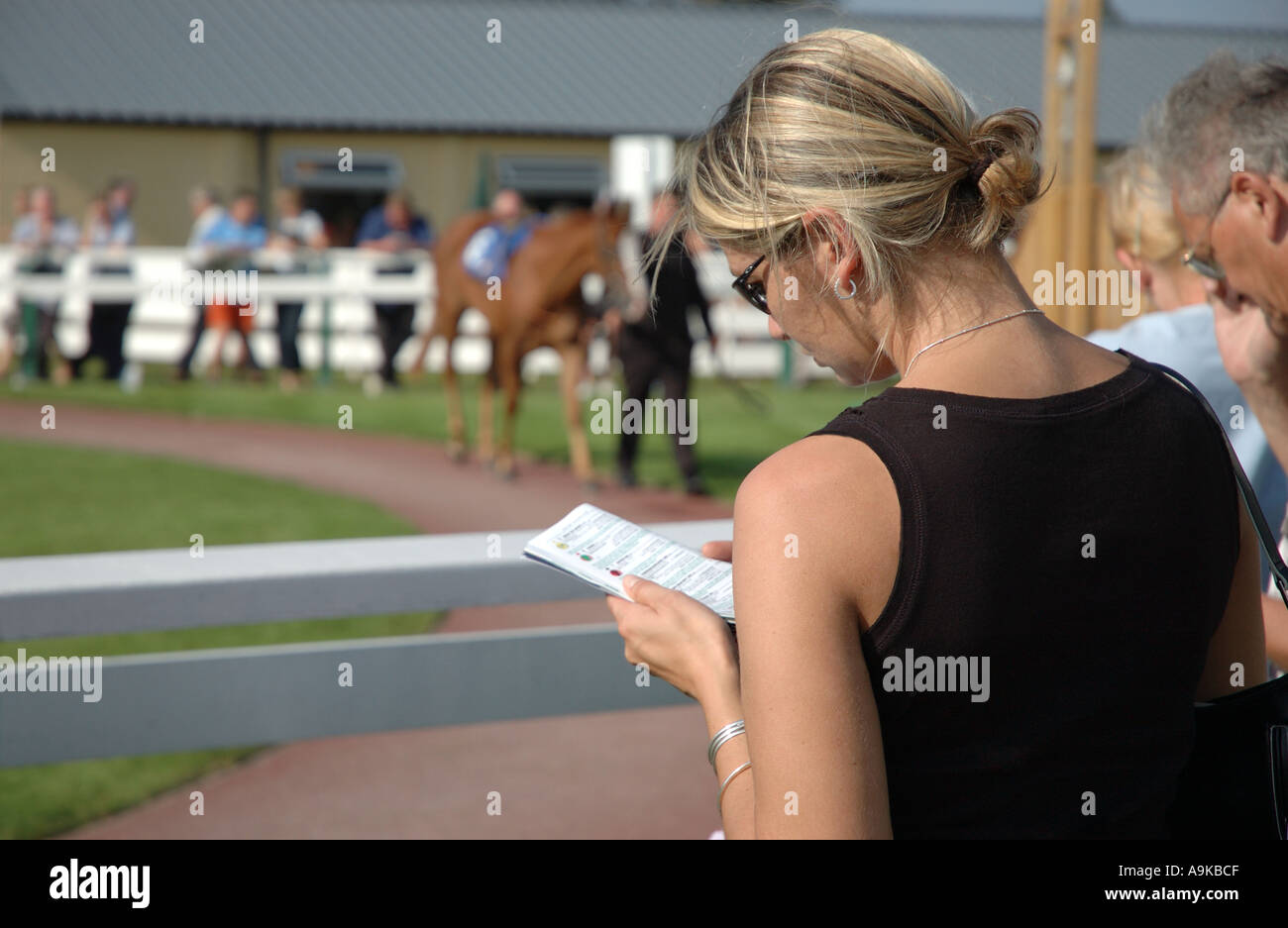 Young woman at the races Stock Photo - Alamy