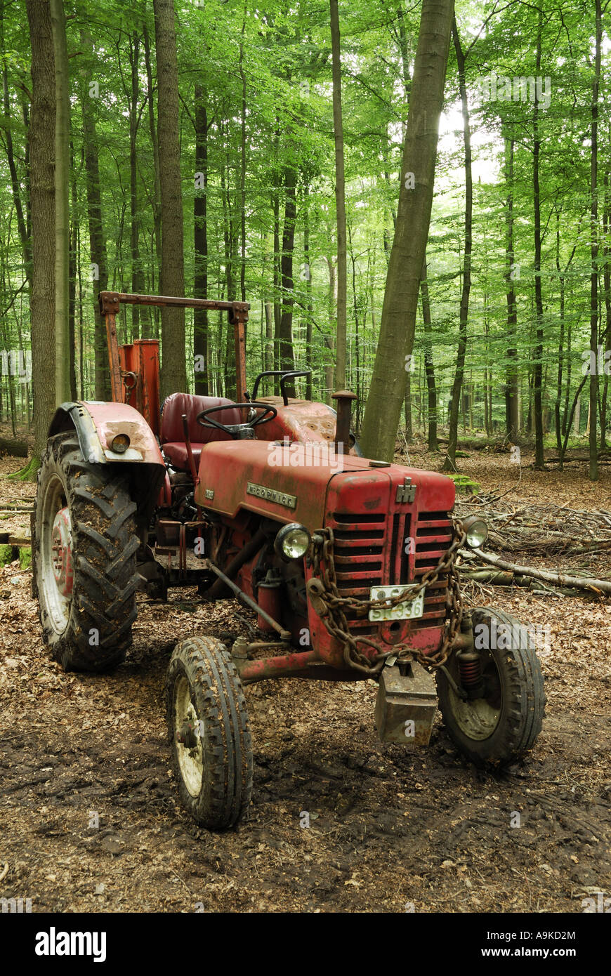 Tractor in deciduous forest hi-res stock photography and images - Alamy