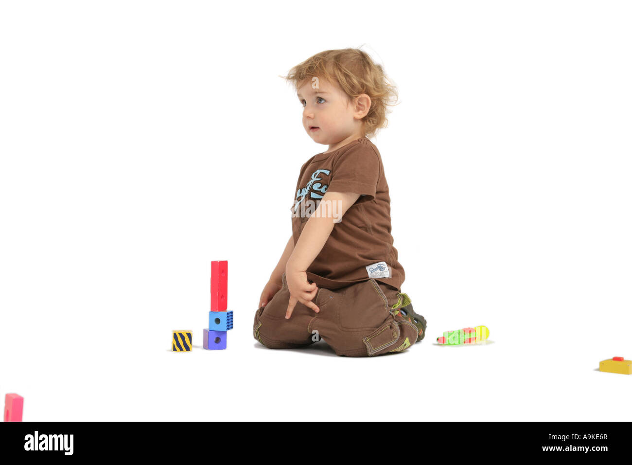 small boy builds brick tower, Germany Stock Photo - Alamy