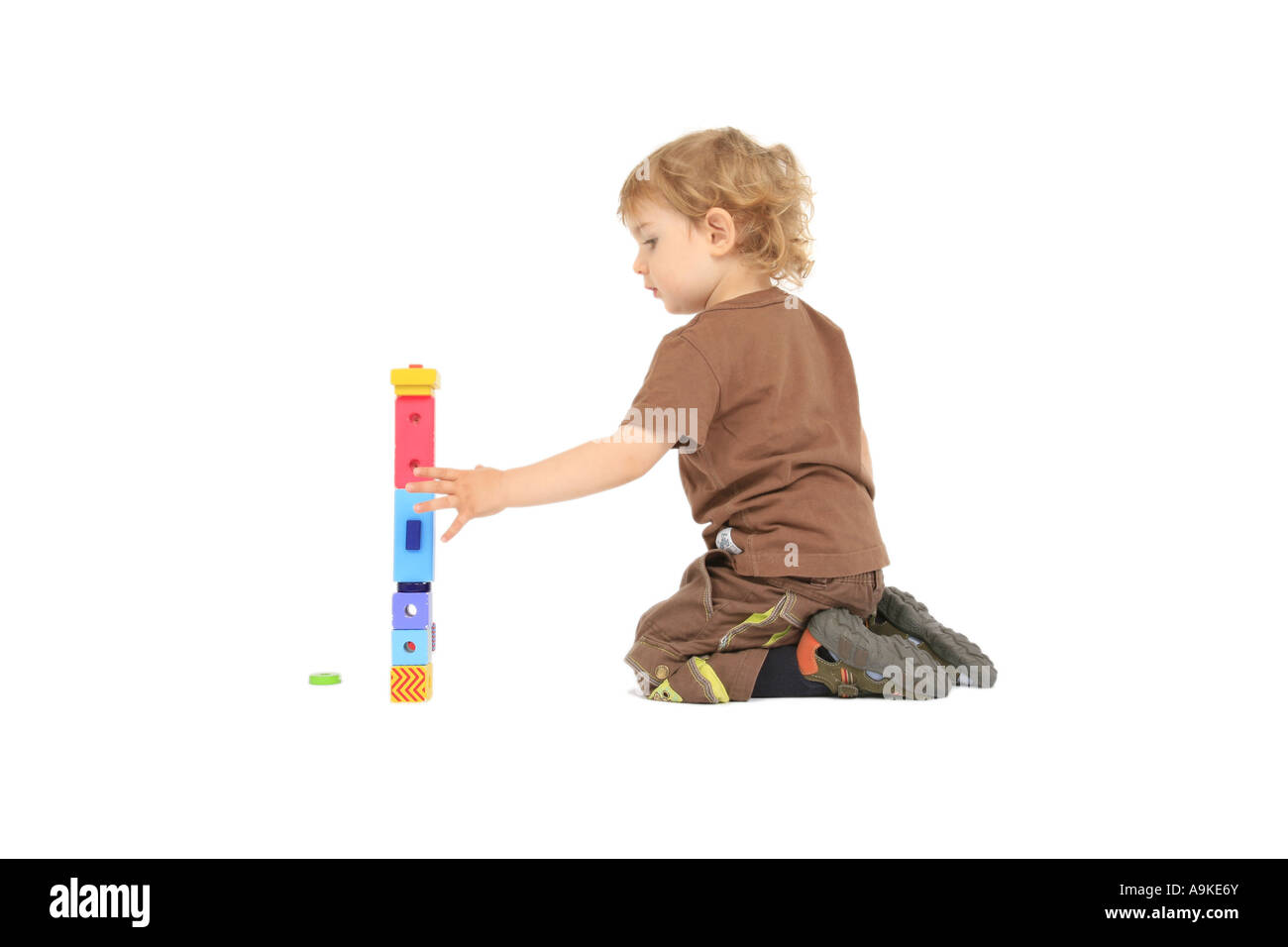 small boy builds brick tower, Germany Stock Photo - Alamy