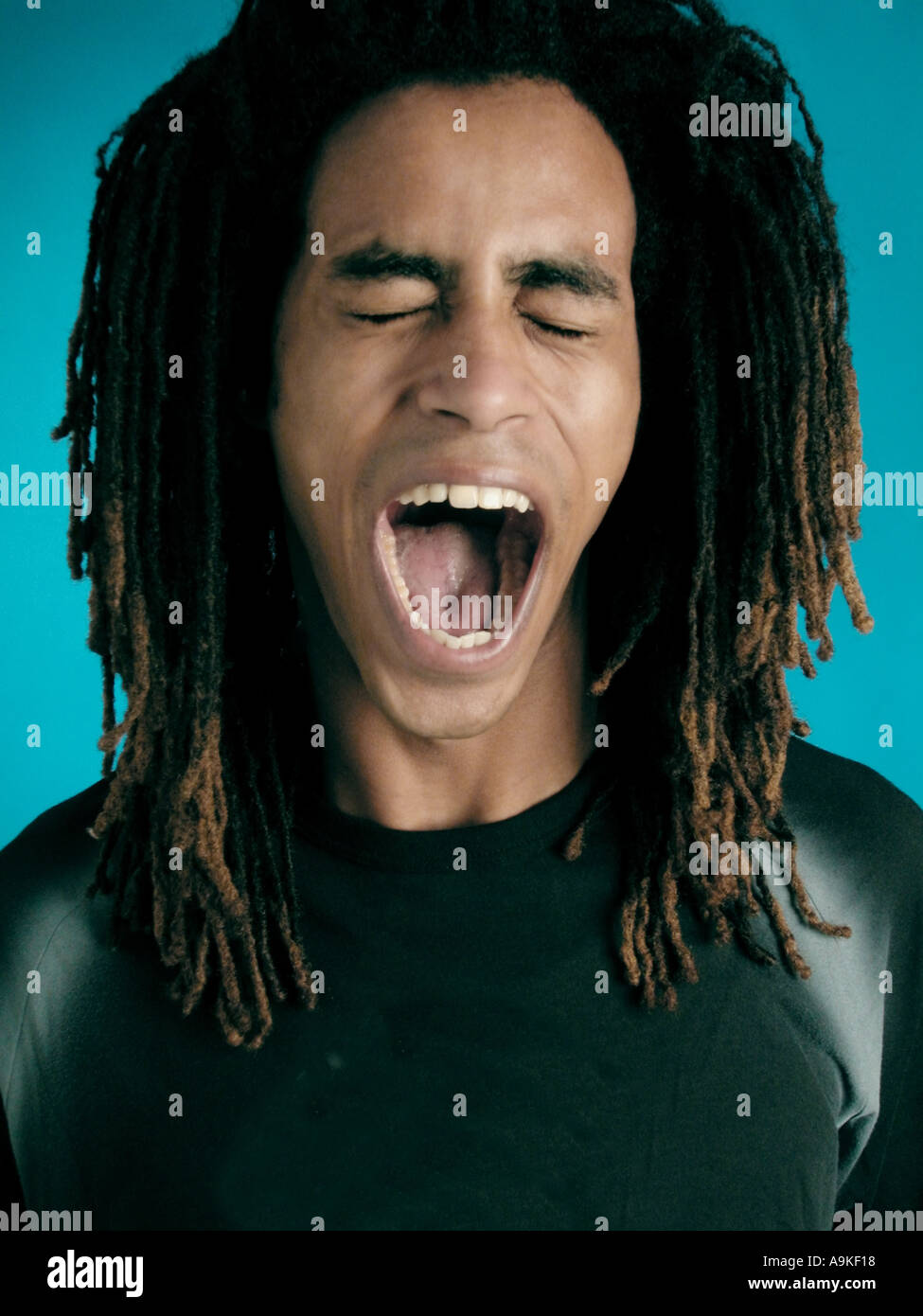 Black man dreadlocks yelling screaming hi-res stock photography and ...