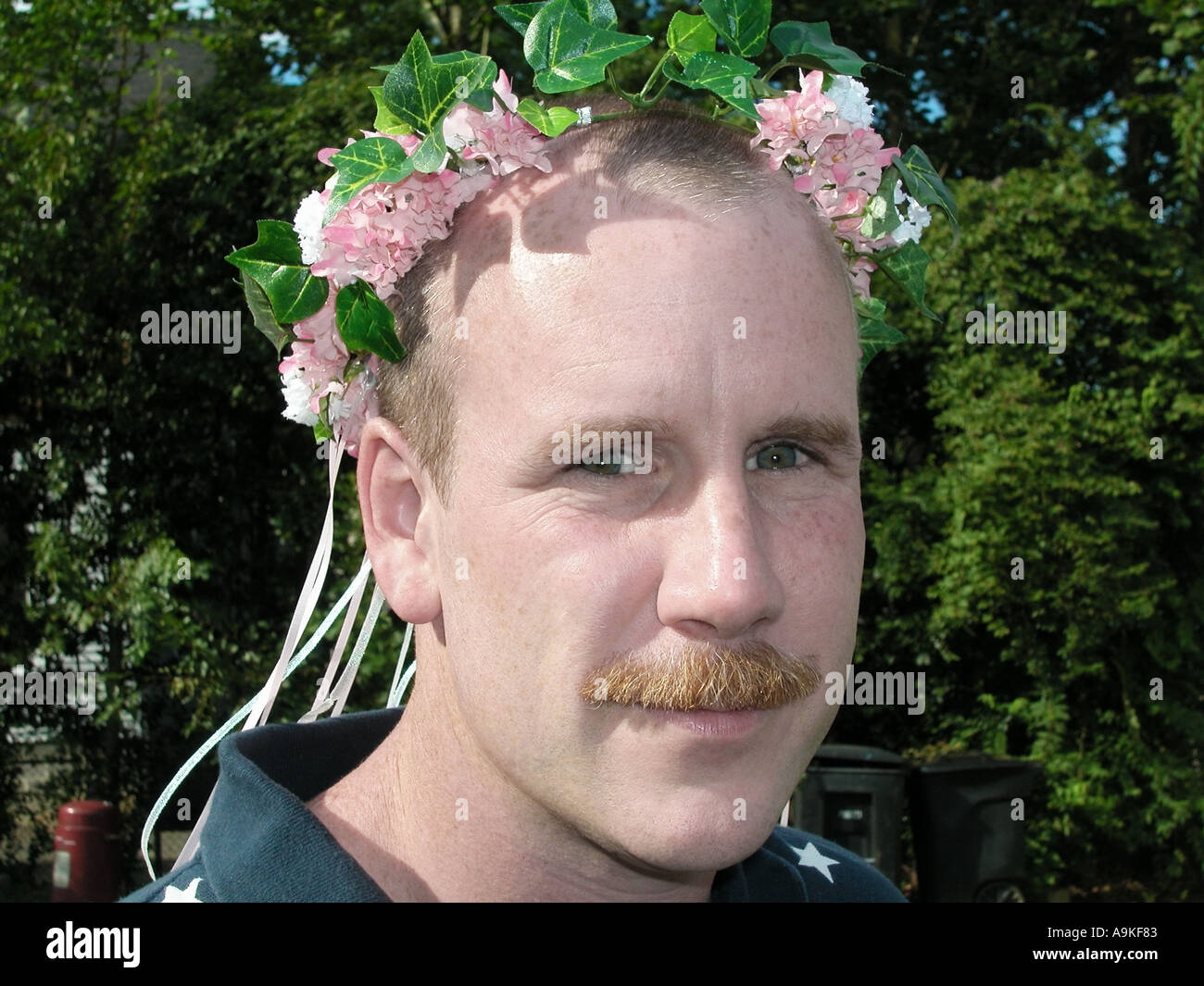 Man in his 40s with moustache wearing wreath on his head portrait Stock ...