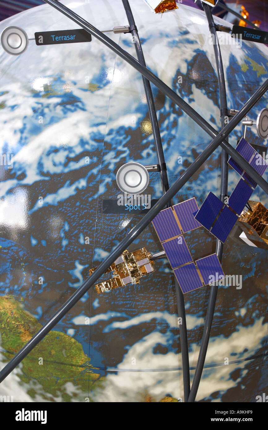 Model of Spot 5 space satellite showing orbit path over Earth Stock ...