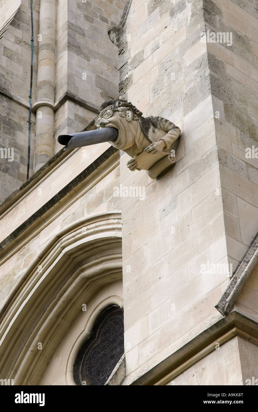 Modern restored replacement gargoyle modelled on a lawyer barrister or ...