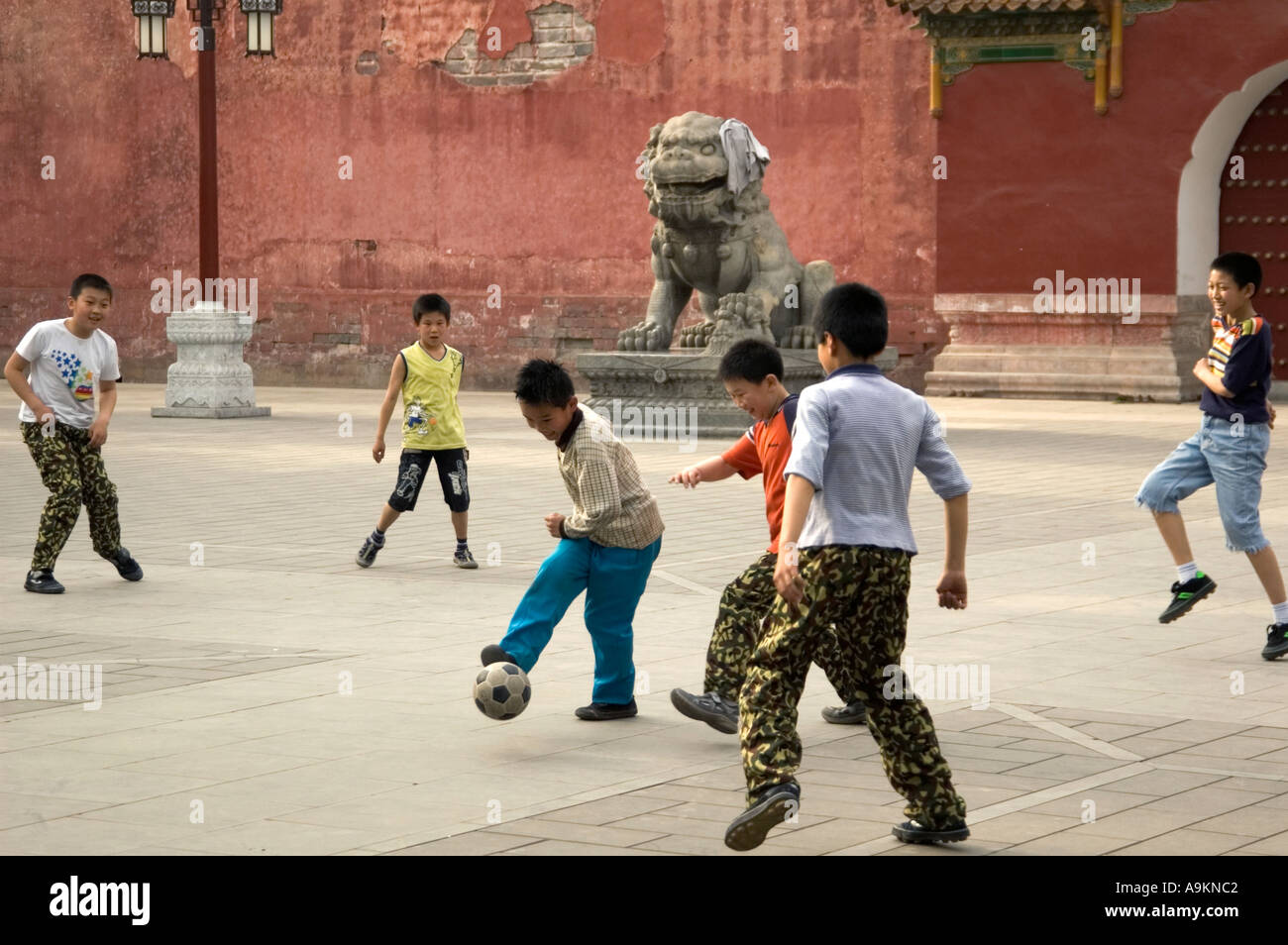 CHILDREN PLAYING FOOTBALL IN JINGSHANG PARK DONGCHENG BEIJING CHINA ...