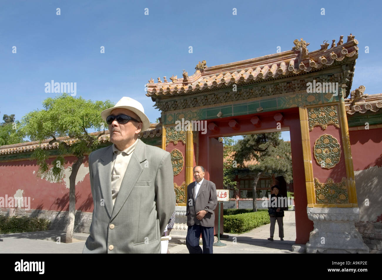 PEOPLE STROLLING THROUGH TRADITIONAL CHINESE WALLED GARDEN IN JINGSHAN ...