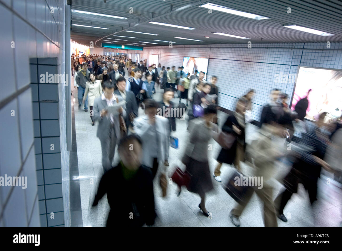 MASSIVE STREAM OF COMMUTERS DURING RUSH HOUR IN SUBWAY STATION AT ...