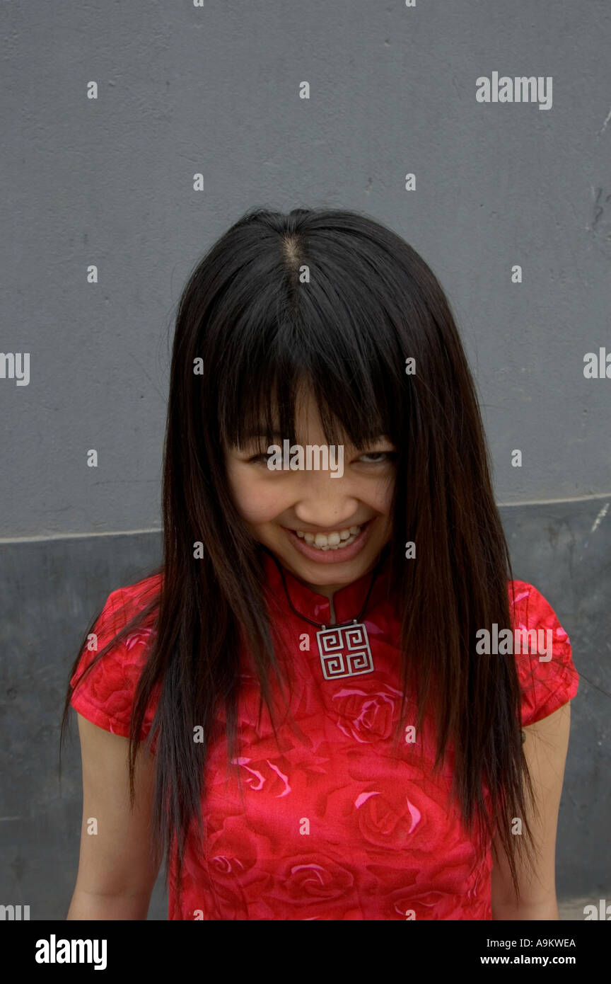 MODEL RELEASED PORTRAIT OF YOUNG CHINESE WOMAN WITH TRADITIONAL RED ...