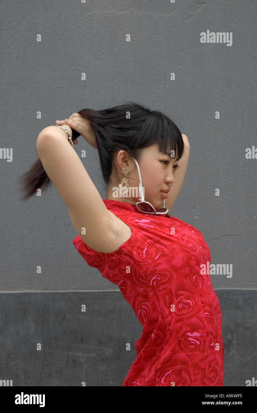 MODEL RELEASED PORTRAIT OF YOUNG CHINESE WOMAN WITH TRADITIONAL RED ...