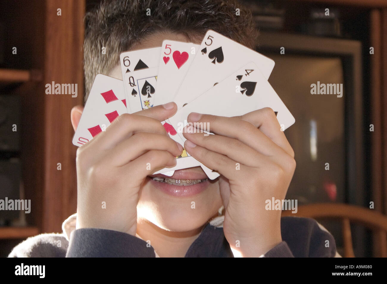 Boy age 12 portrait with playing cards Stock Photo - Alamy