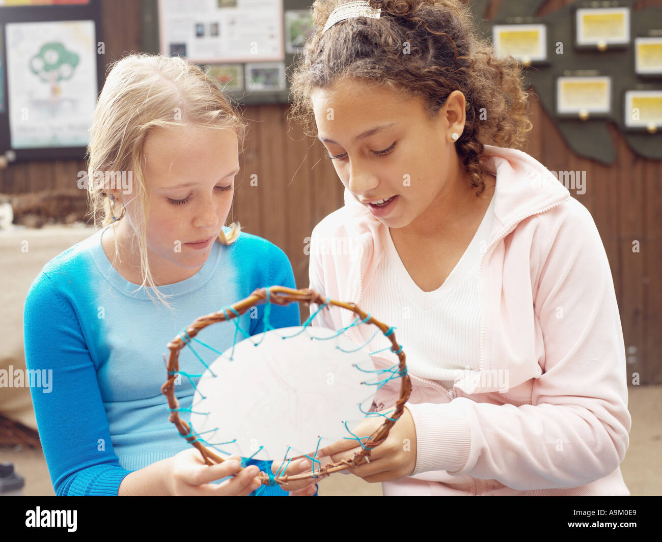 two teenage girls working together in outside classroom Stock Photo - Alamy