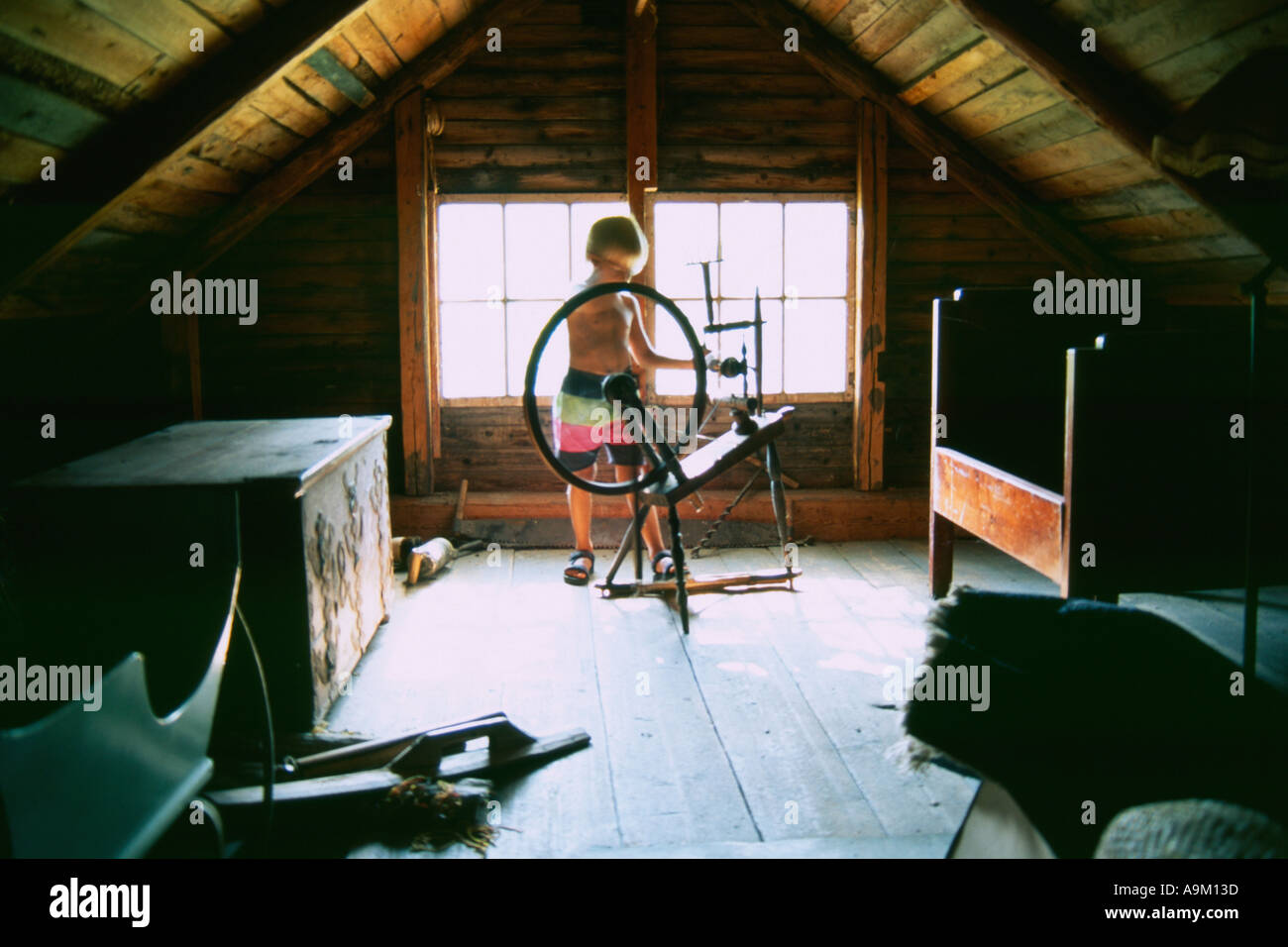 boy playing with spinning wheel Stock Photo - Alamy